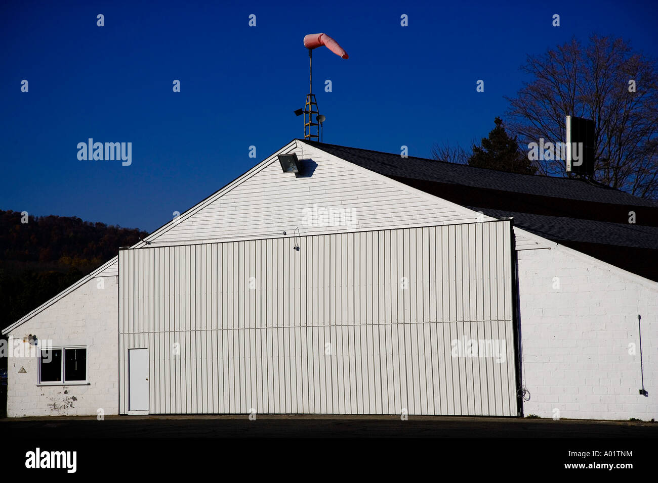 Windsock on top of a building Stock Photo - Alamy