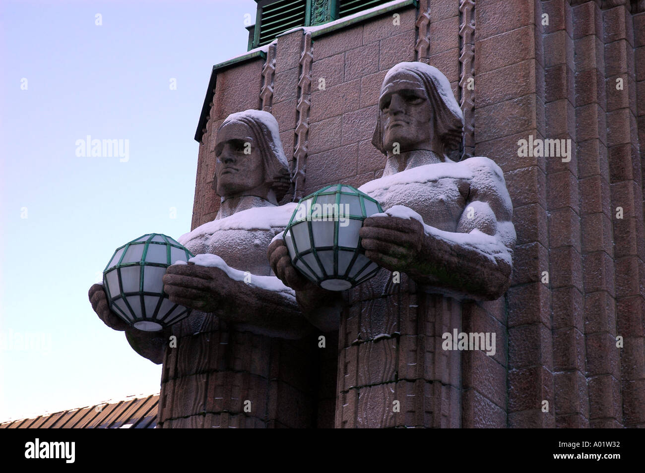 The lantern carrier statues at the entrance to Helsinki railway station ...