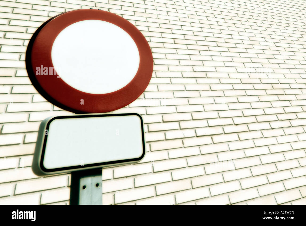 An empty traffic sign with brick wall Stock Photo - Alamy