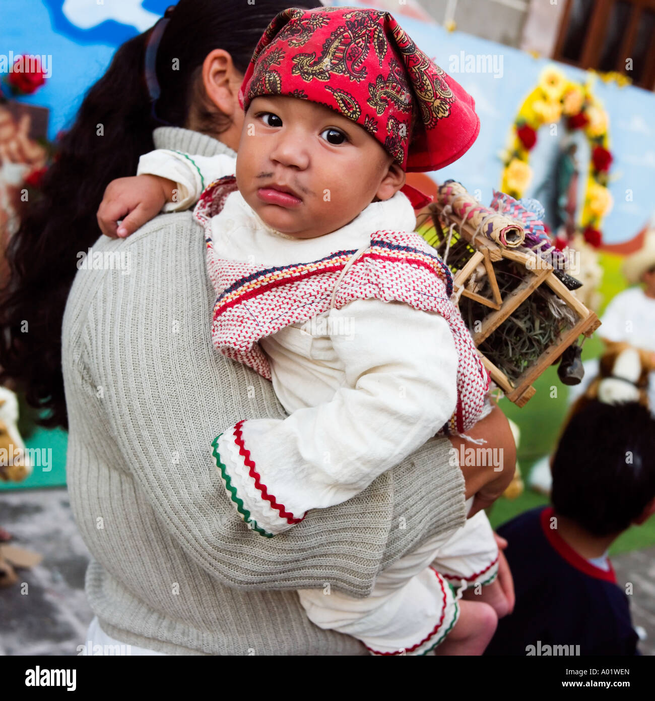 Mother and cute young baby child dressed as Juan Diego on day of The ...