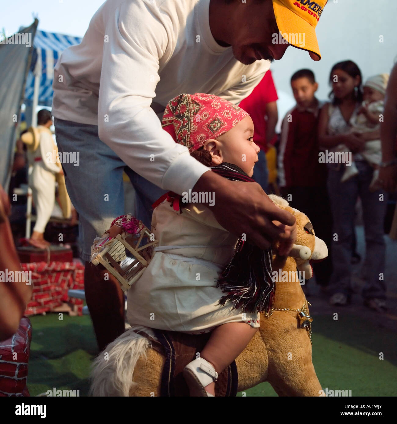 Tiny baby girl dressed at the fiesta of the day of The Virgin Mazatlan ...
