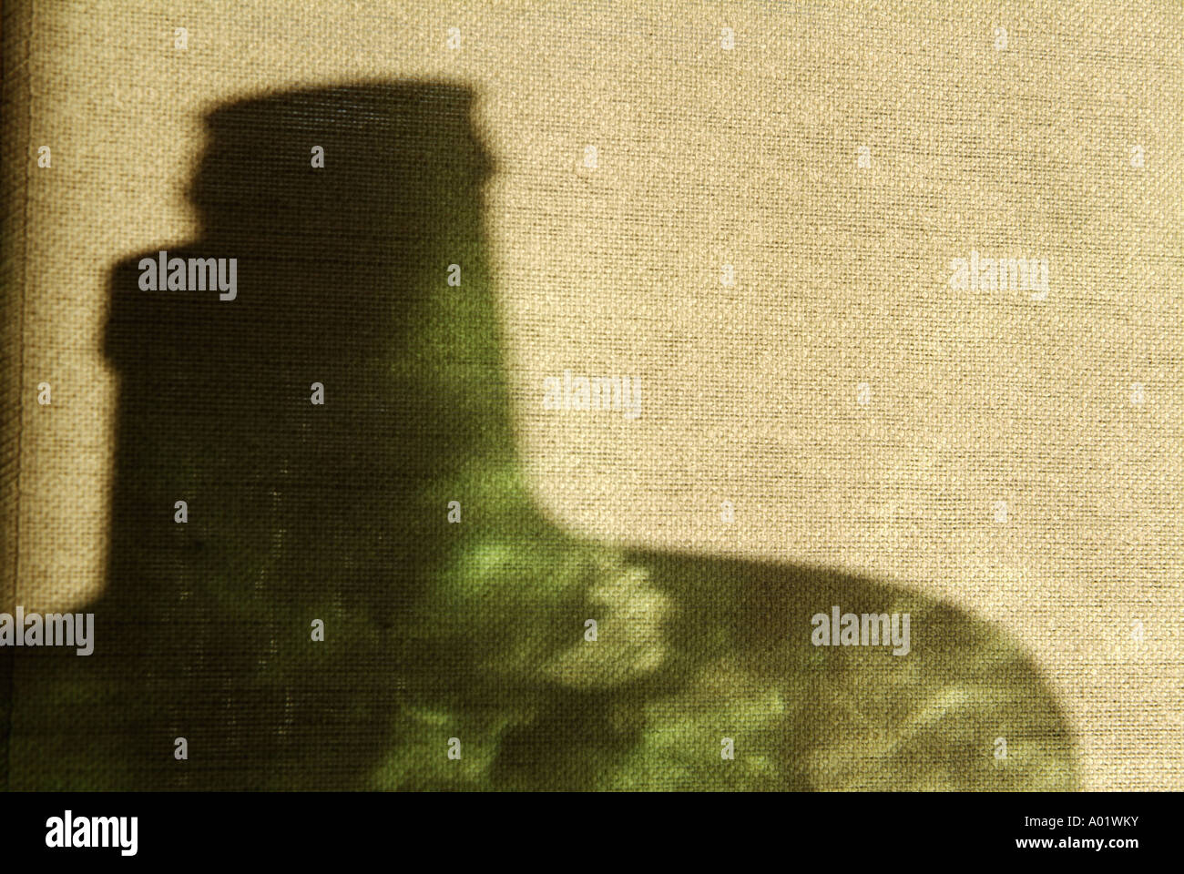 Shadow of a bottle Stock Photo - Alamy