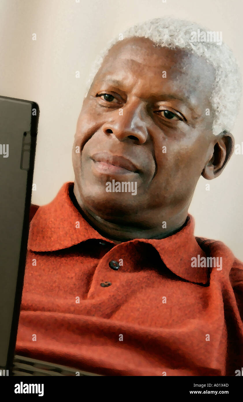 Black senior male working on laptop computer Stock Photo - Alamy