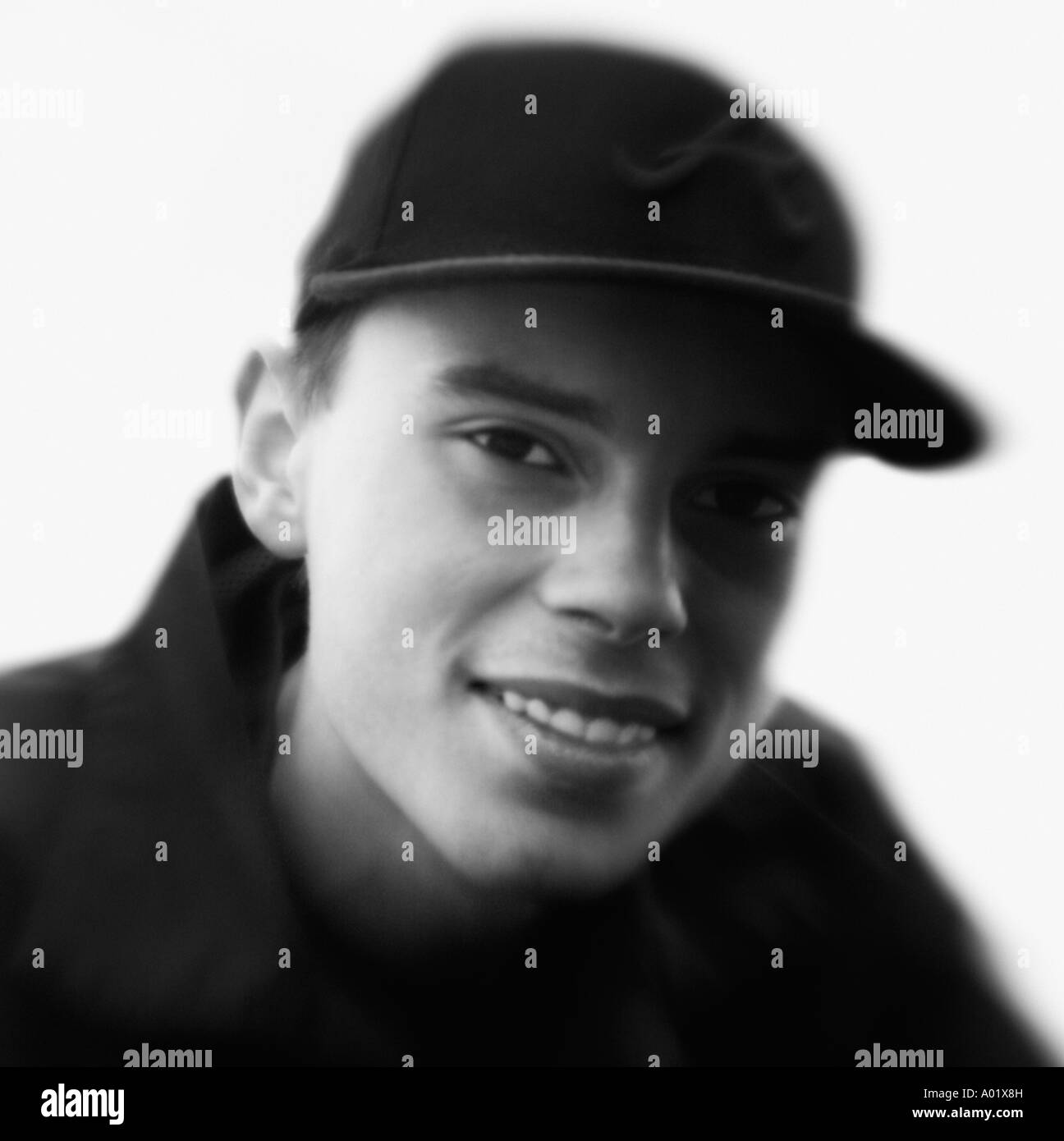Portrait of young man wearing baseball cap close up Stock Photo - Alamy
