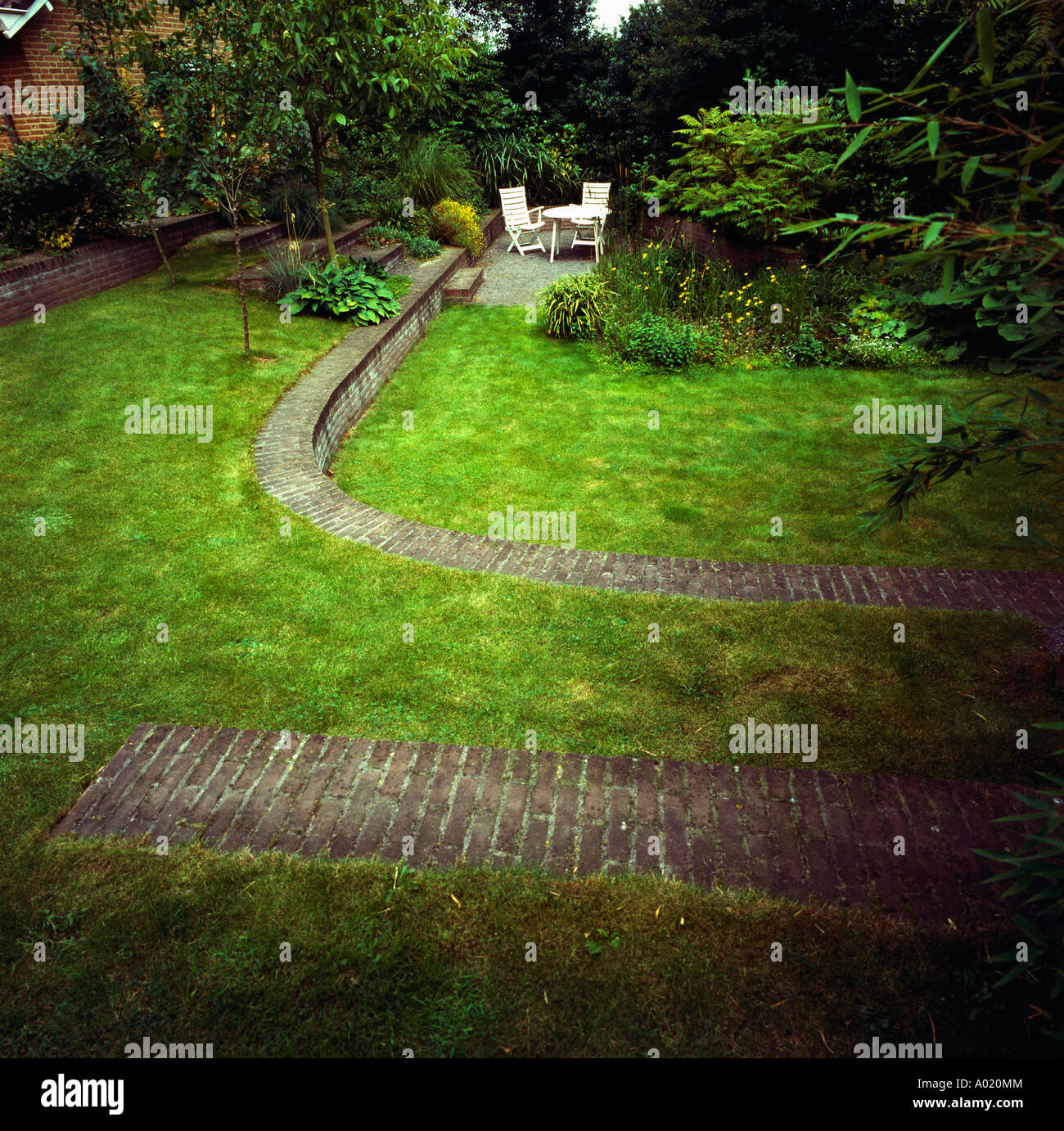 Birds-eye view of sunken lawn and walls with small patio Stock Photo ...