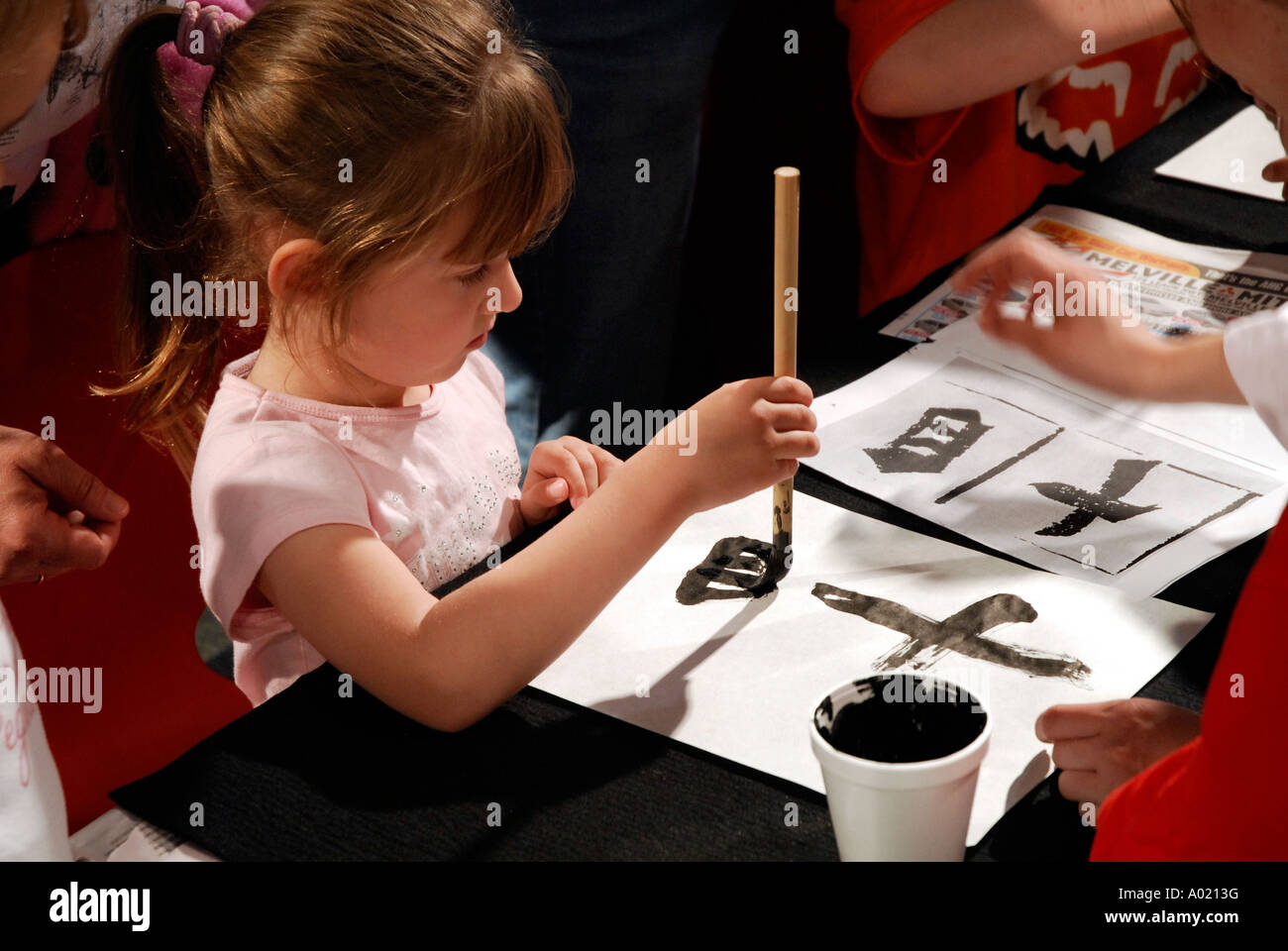 4 year old Australian child being taught Japanese caligraphy Stock ...