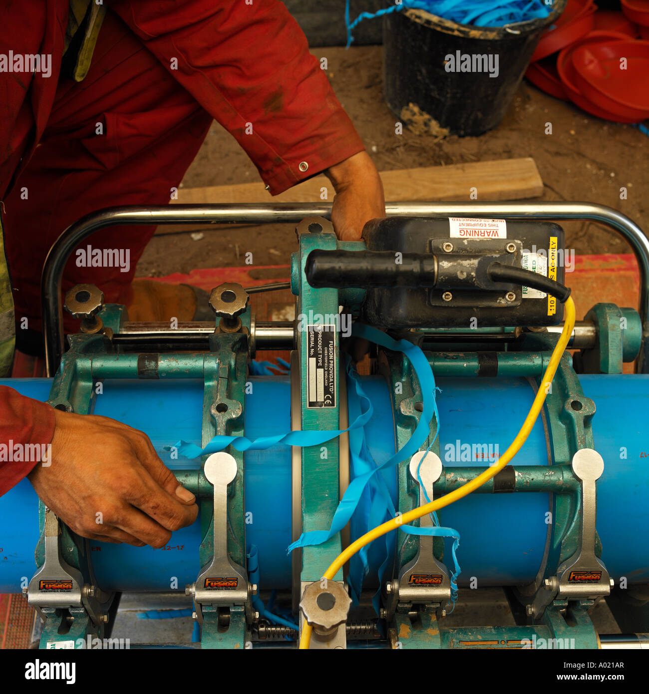 Water engineer joins plastic water pipes with butt heat fusion heating ...