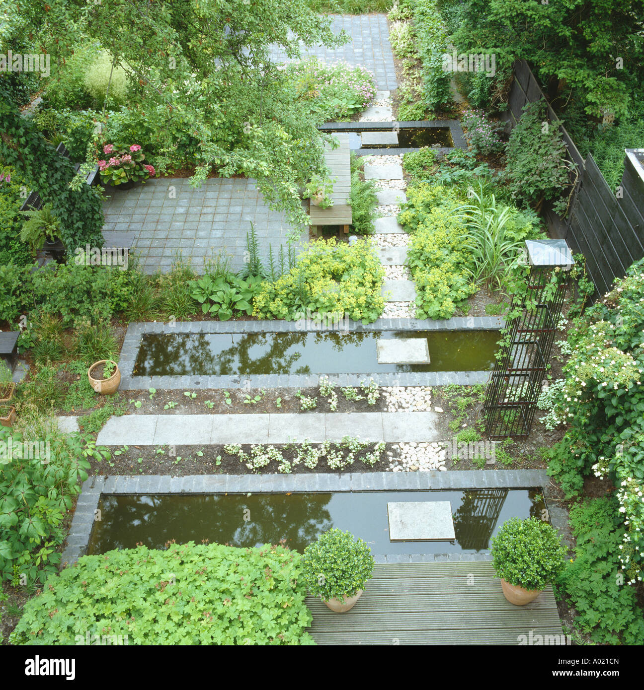 Aerial view of paved garden with rectangular ponds and small shrubs ...