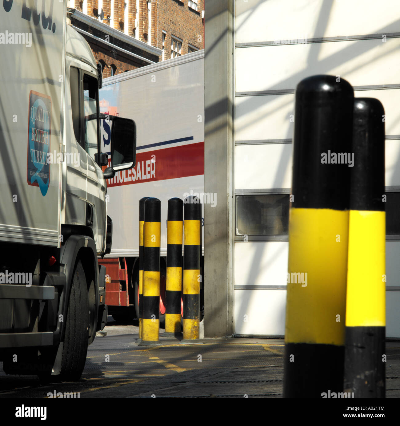 Articulated lorries queue up at Smithfield Meat market lorry reflecting ...