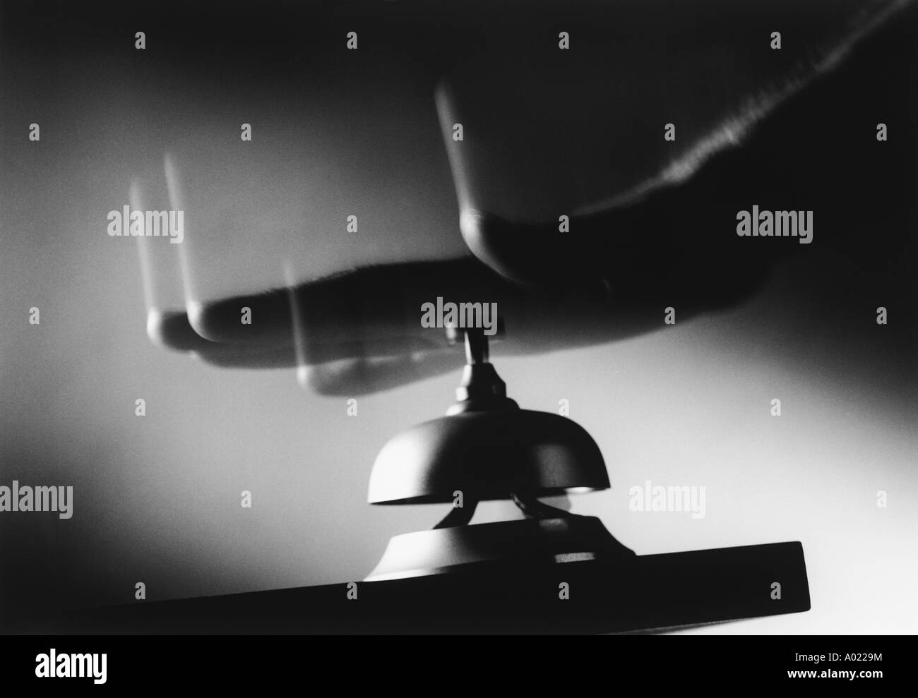 Hand hitting service bell, (b&w), (close-up Stock Photo - Alamy