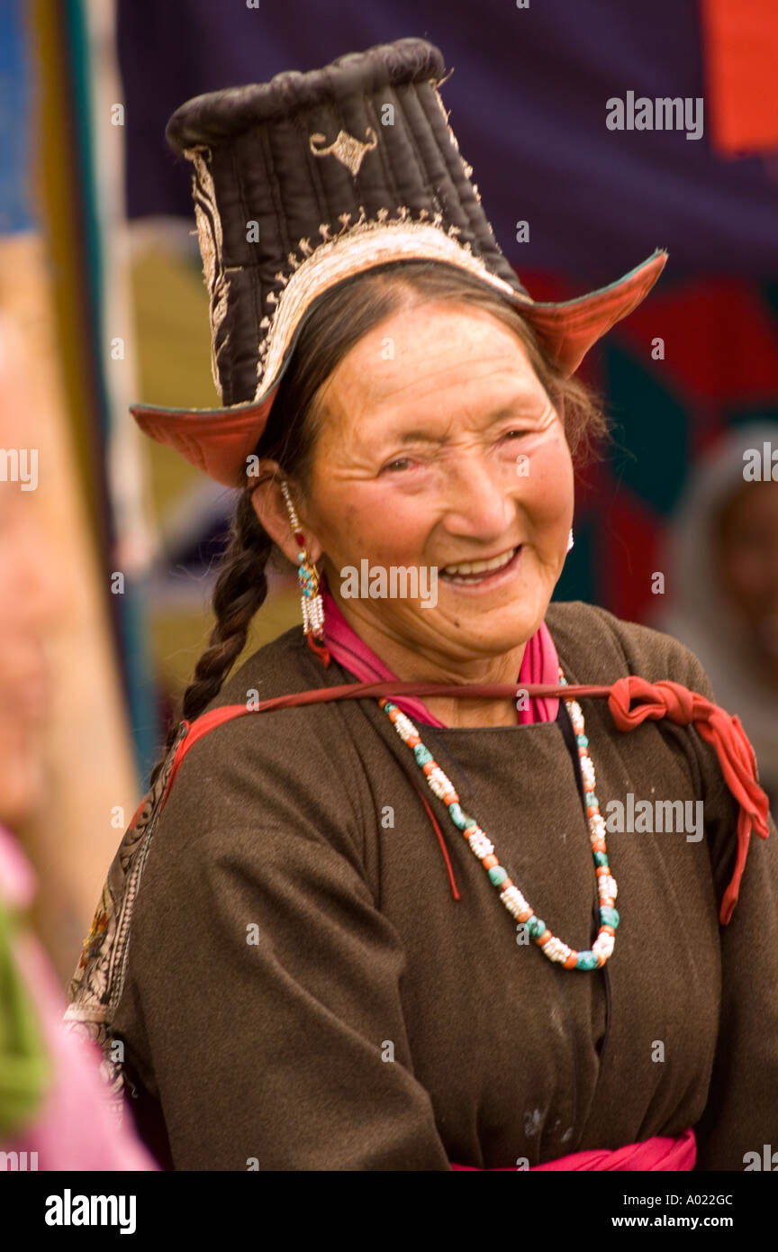 Smiling old Ladakhi woman in traditional dress and hat Leh Ladakh India ...