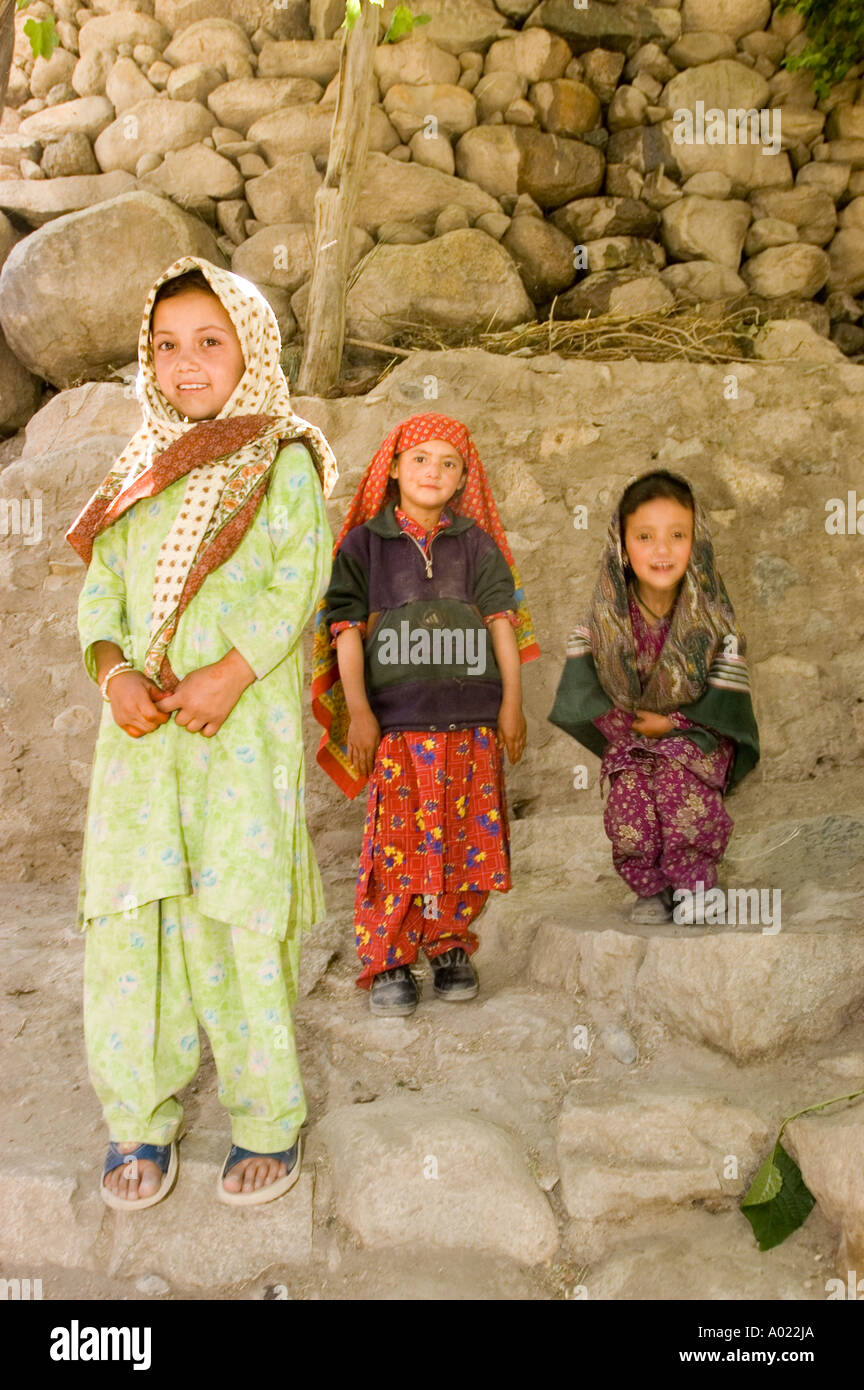 A group of young Muslim Dard or Brokpa girl in color clothes looking at ...