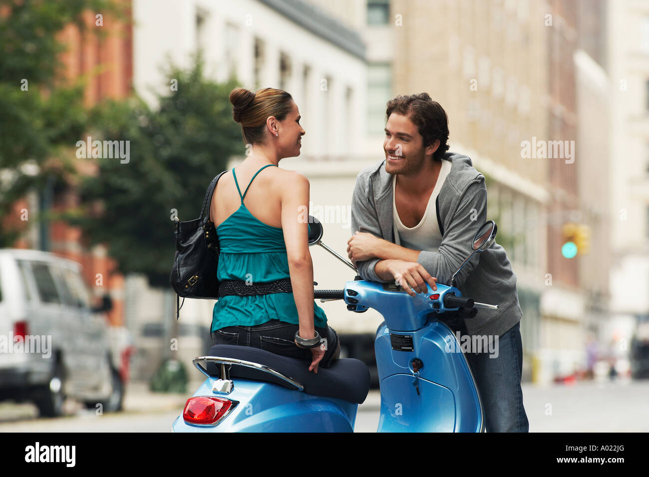 Woman on moped talking hi-res stock photography and images - Alamy