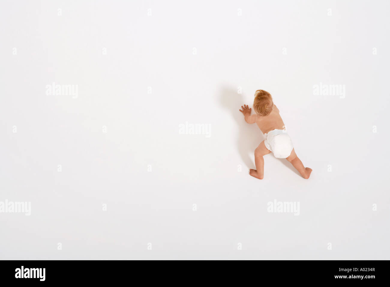 Crawling baby from above Stock Photo - Alamy