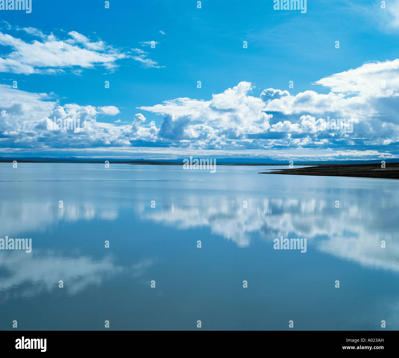 Clouds reflecting on water Stock Photo - Alamy