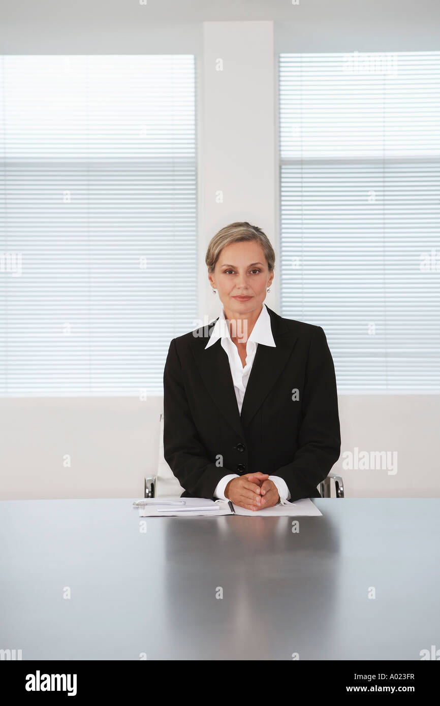 Business Executive Sitting in Boardroom Stock Photo - Alamy