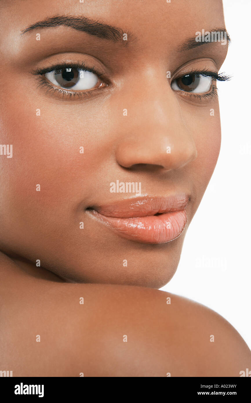 Beautiful Young looking over shoulder Stock Photo - Alamy