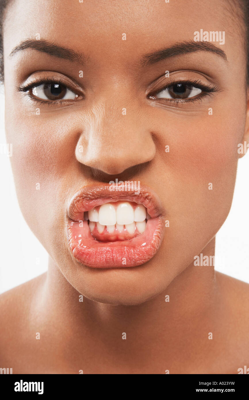 Beautiful Young Woman, making facial expression Stock Photo - Alamy