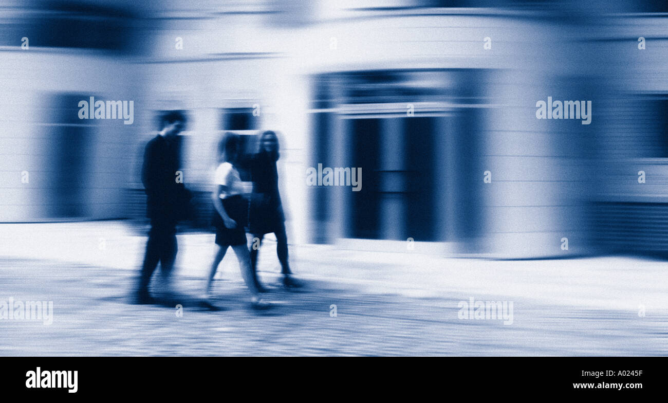 Blurred business people walking past building Stock Photo - Alamy