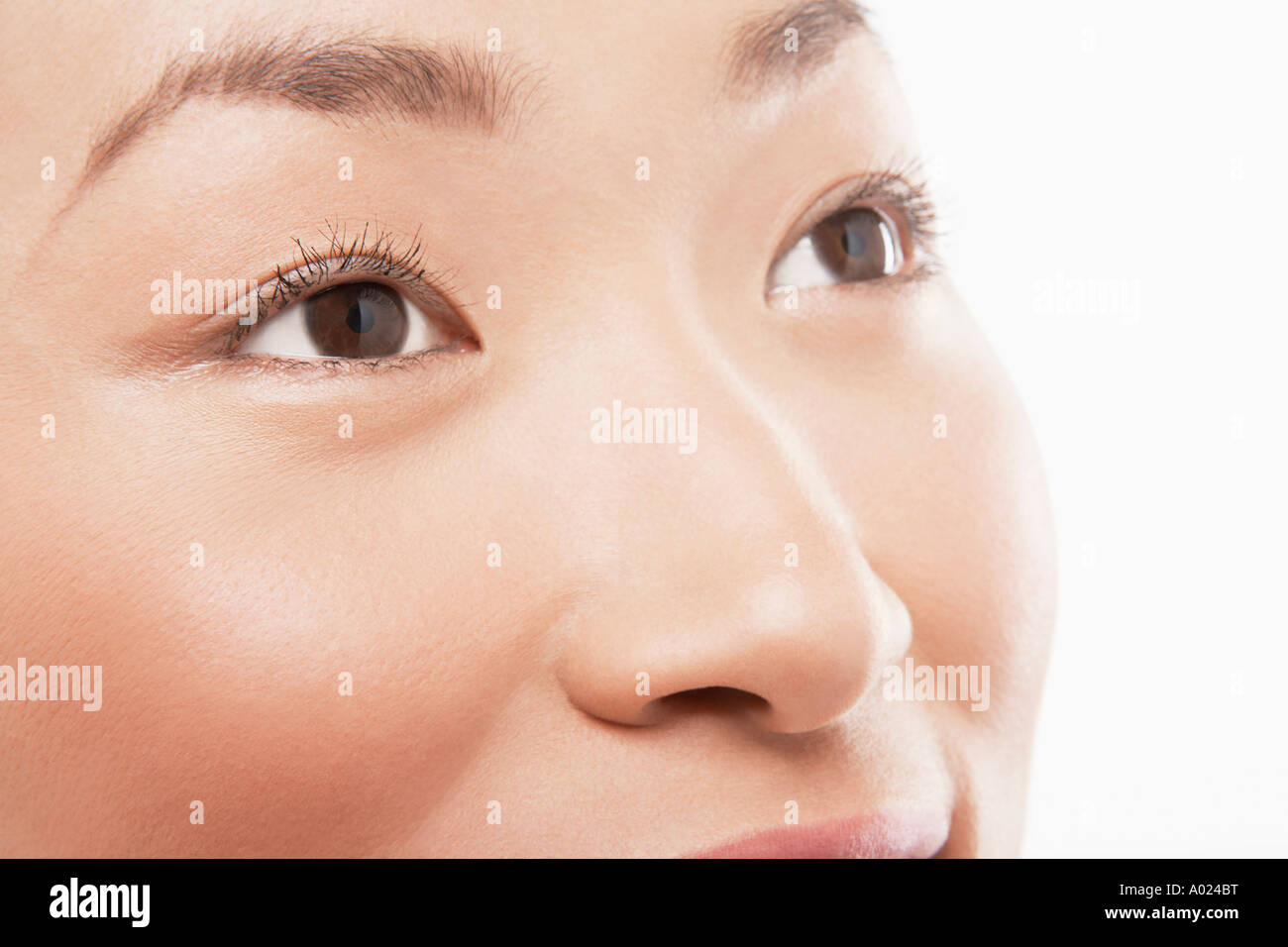 Young Asian woman's face, looking up Stock Photo - Alamy