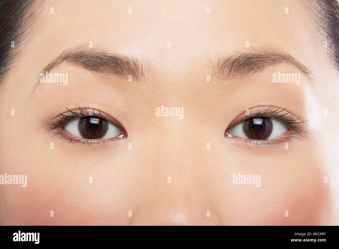 Young Asian woman's eyes Stock Photo - Alamy