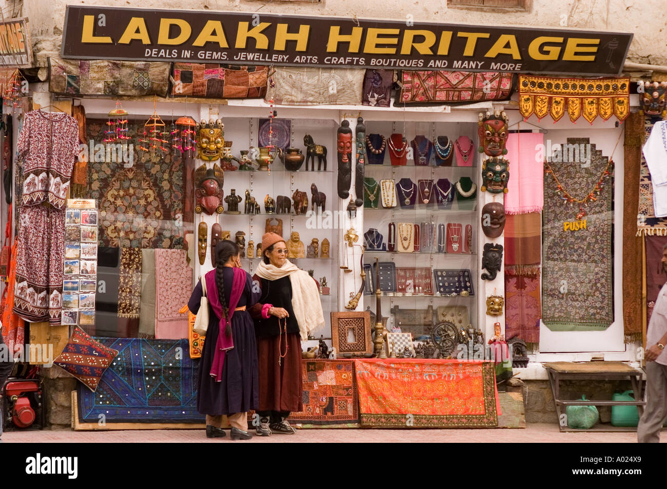 Two Ladakhi woman in traditional dress standing behind Ladakh Heritage ...