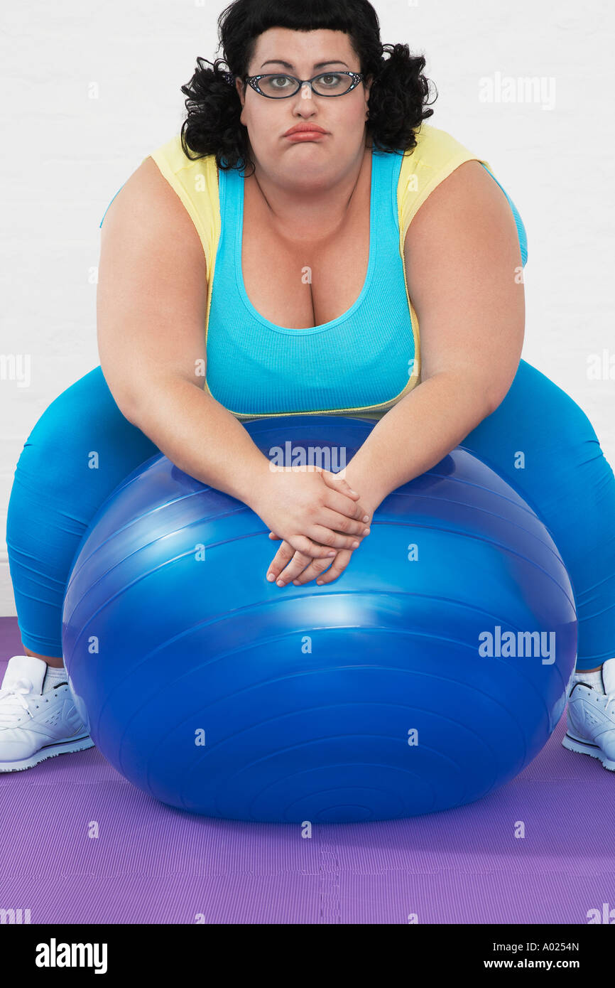 Overweight Woman sitting on Exercise Ball, portrait Stock Photo - Alamy