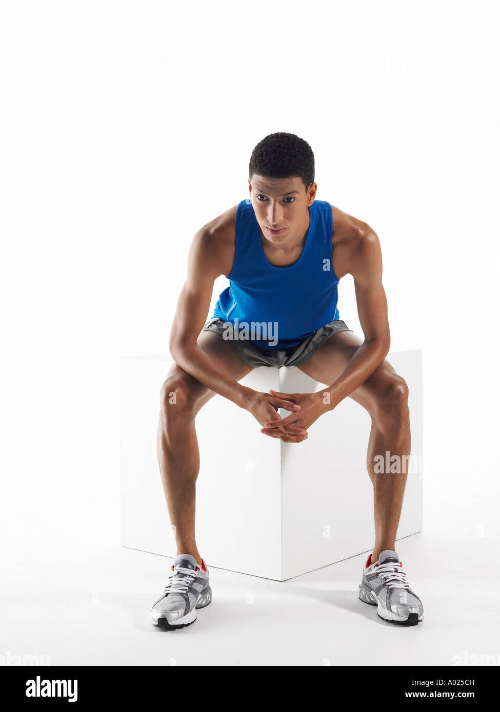 Athlete sitting on a box Stock Photo - Alamy