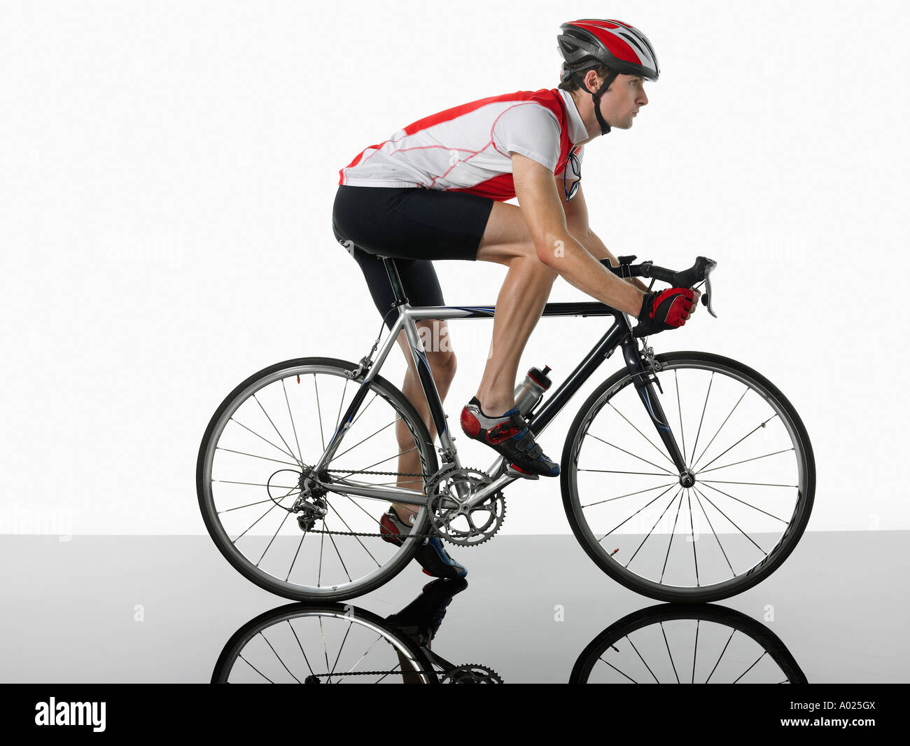 Bicyclist mounted on bicycle, profile Stock Photo - Alamy