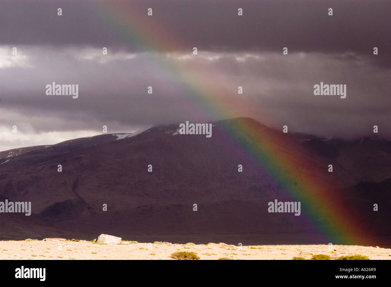 Rainbow over Rupshu area near Tso Kar Lake Ladakh Jammu Kashmir India ...