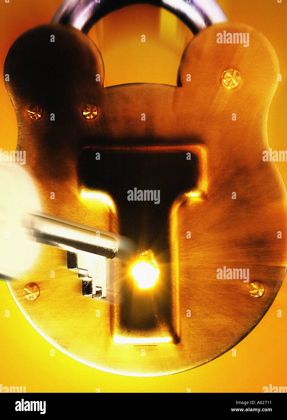 Key about to open padlock Stock Photo - Alamy