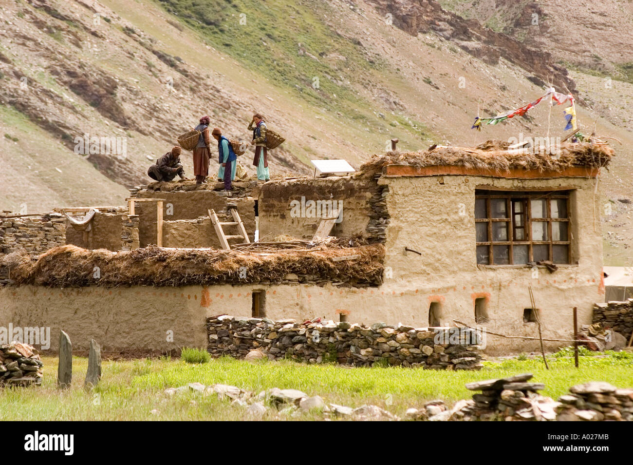 People sitting on the roof of traditional Zanskari house in Rangdum ...