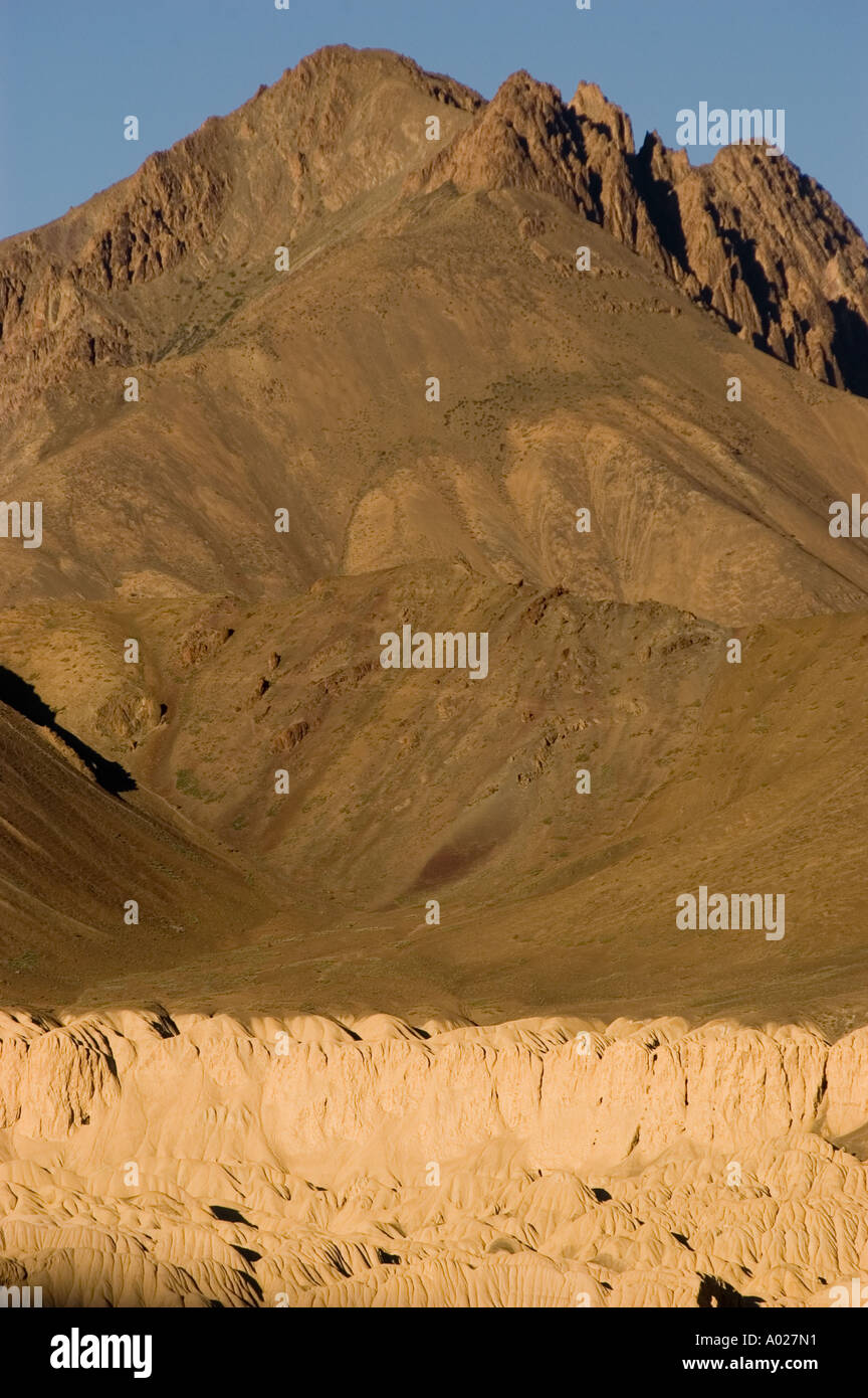 Yellow and brown strange rock formations of empty sediment lake with ...