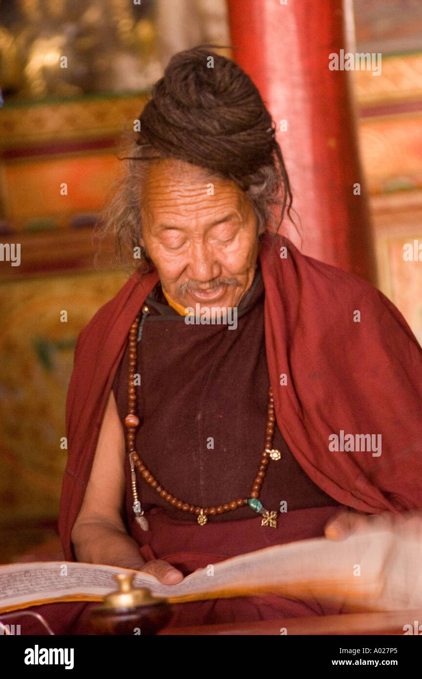 Buddhist yogi praying and reciting during puja in Lamayuru Ladakh Jammu ...