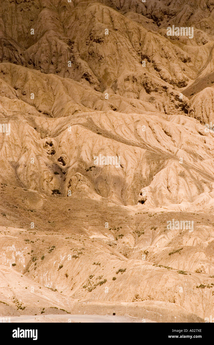 Yellow rock formations of empty sediment lake Lamayuru Ladakh Kashmir ...
