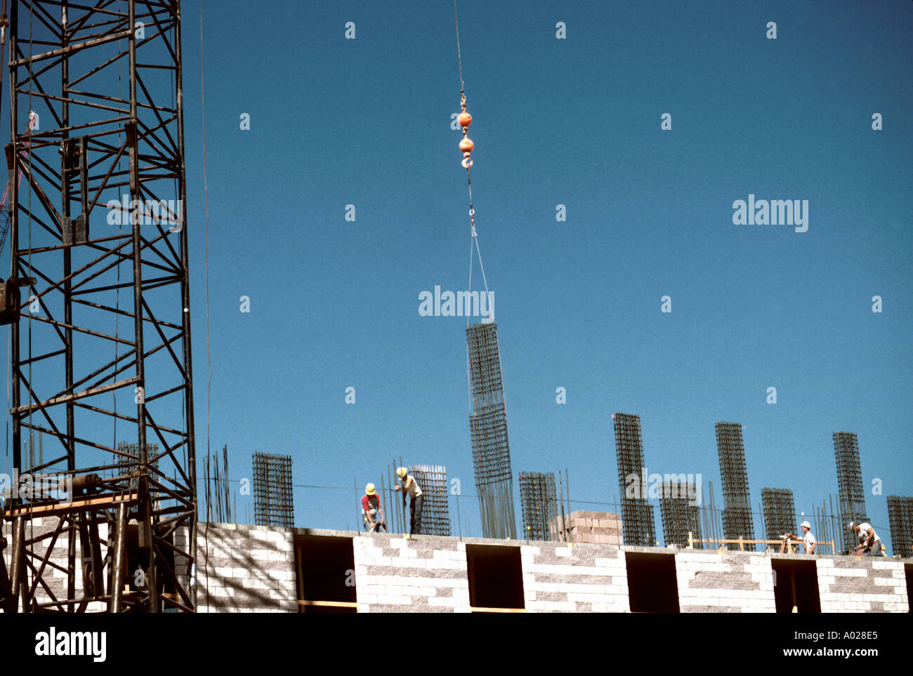 Construction workers on high rise building Stock Photo - Alamy