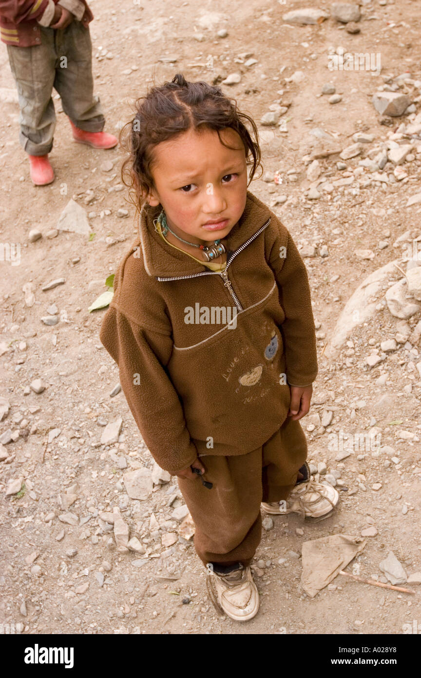 A modern dress sad small Ladakhi girl Zanskar Ladakh Kashmir India ...