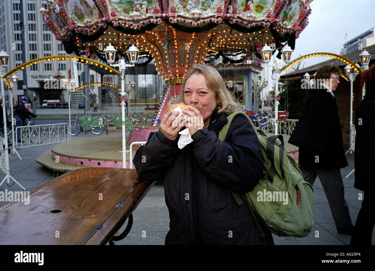 Berlin, Germany. Model released woman eats traditional German sausage ...