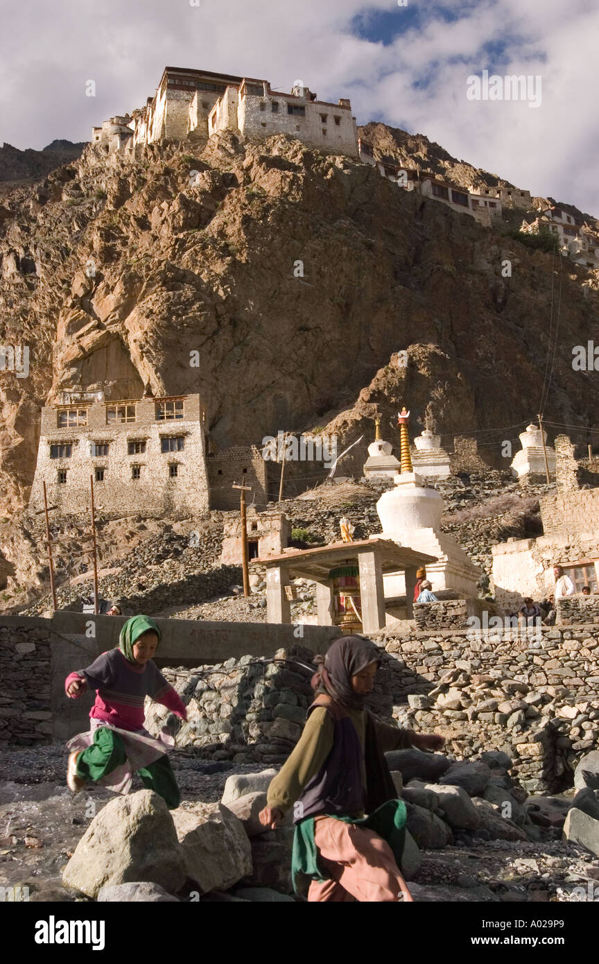 Traditional dress Ladakhi girls jumping over stream with Karsha ...