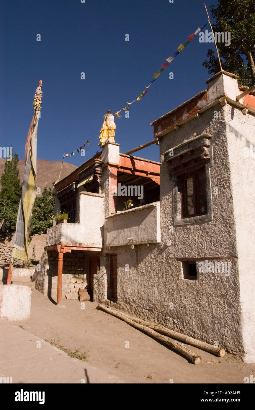 Facade of traditional Ladakhi house with Buddhist prayer flags Alchi ...