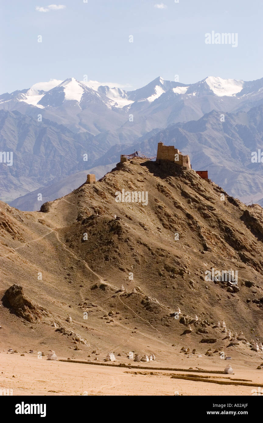 Ruins of uphill Leh castle with snow capped Zanskar Range mountains Leh ...