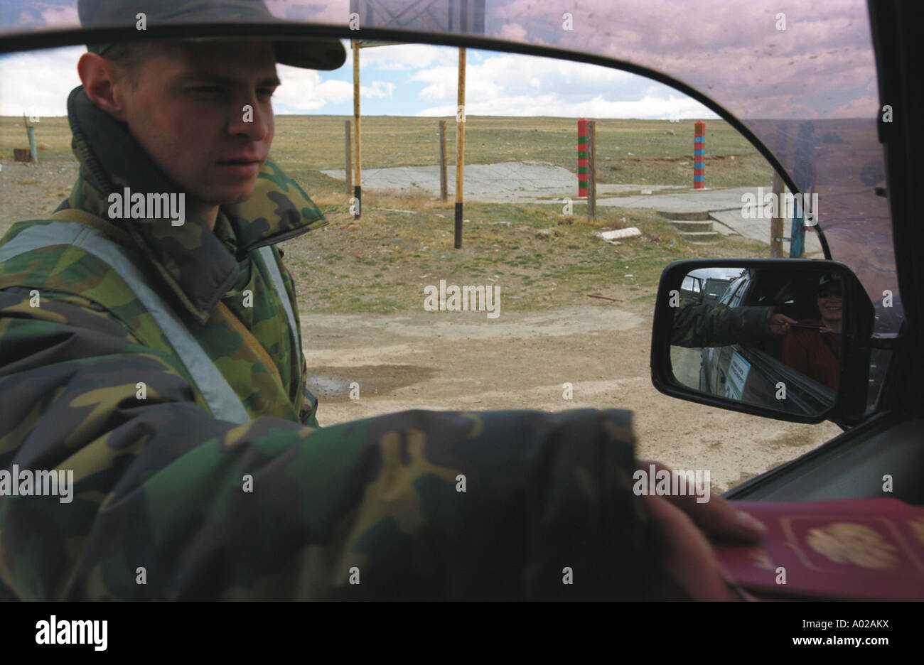 Russian border guard checking a passport. The Durbet-Daba Pass. Russian ...