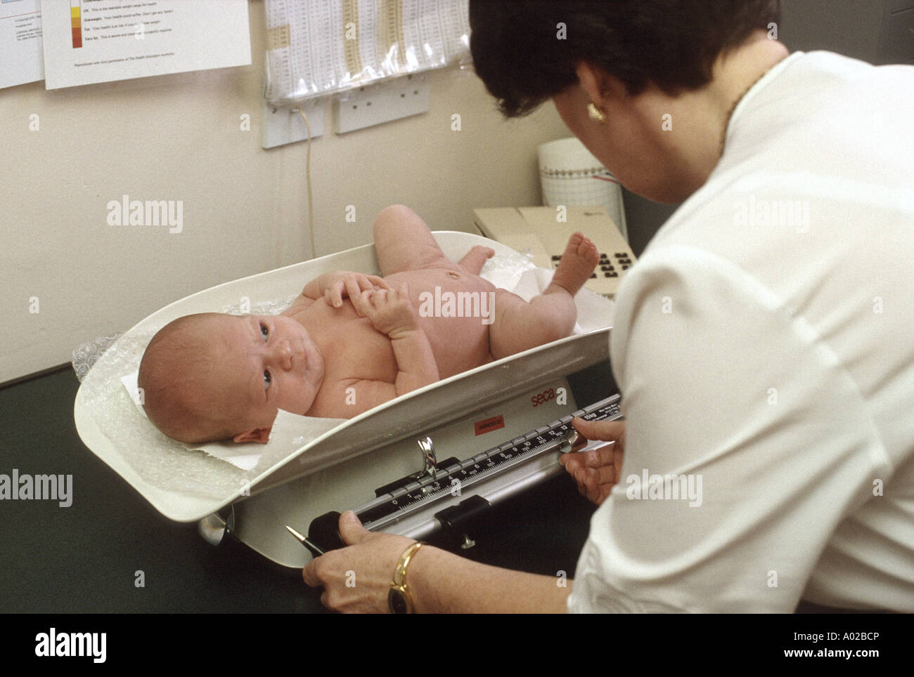 Weighing a baby hi-res stock photography and images - Alamy
