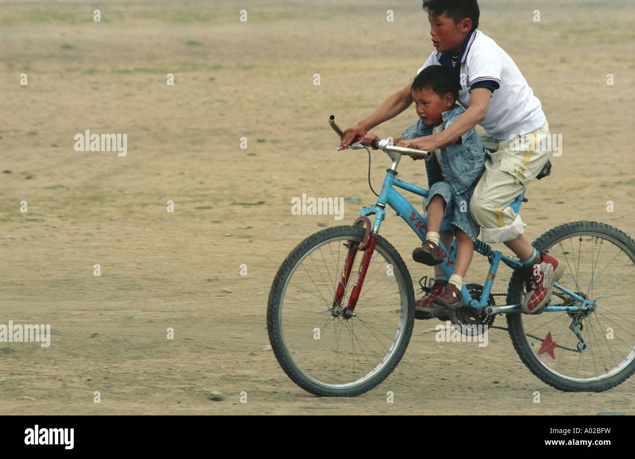 Child riding a two wheel bike hi-res stock photography and images - Alamy