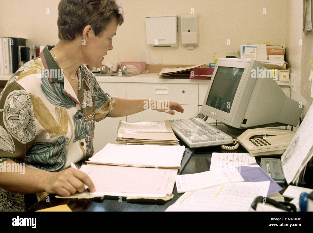 GP using computer in surgery Stock Photo - Alamy