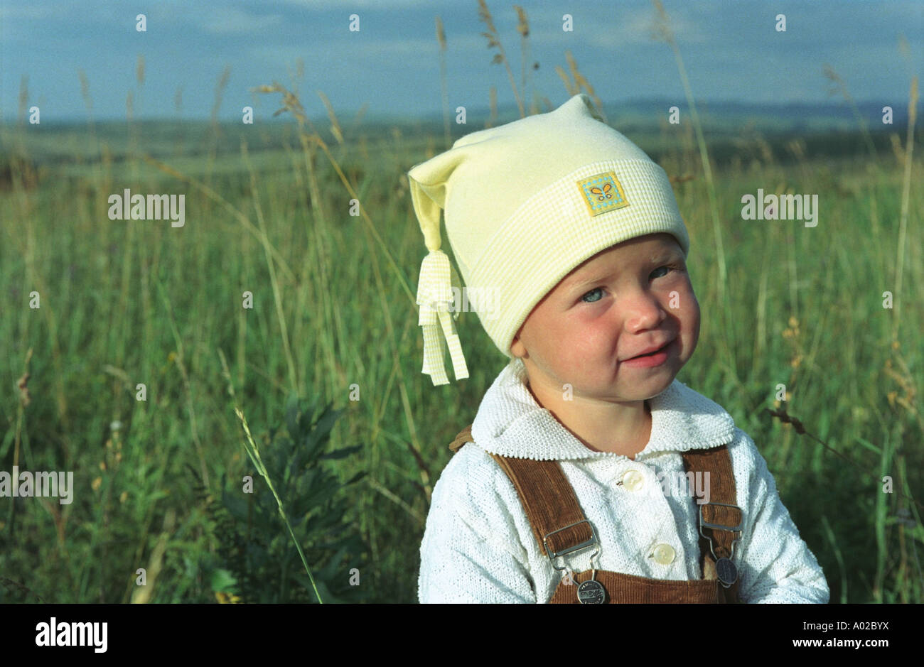 Portrait of 1 one year old baby in field. Altai. Siberia. Russia Stock ...