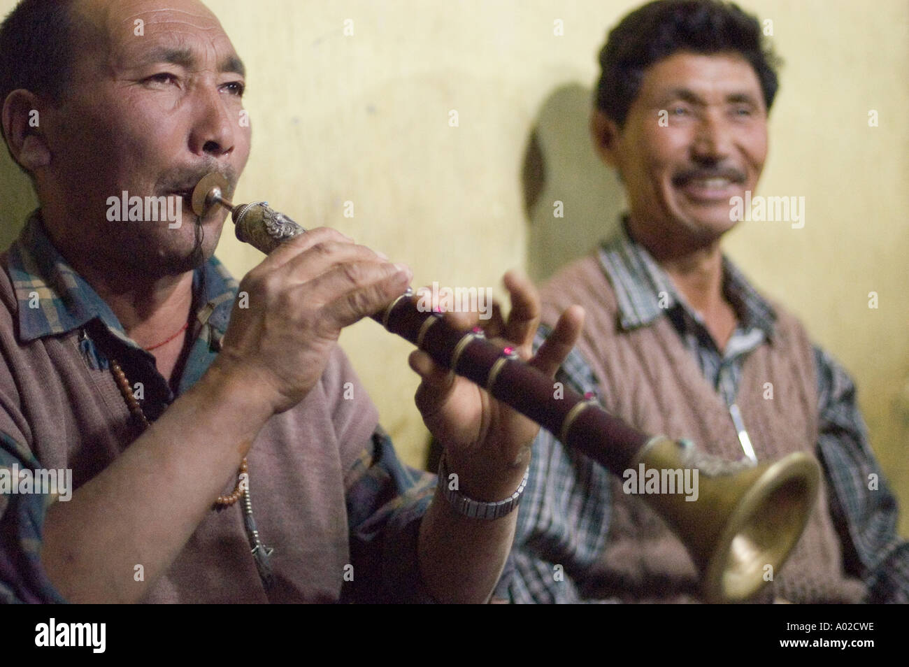 Ladakhi man playing traditional music instrument Surma trumpet Ladakh ...