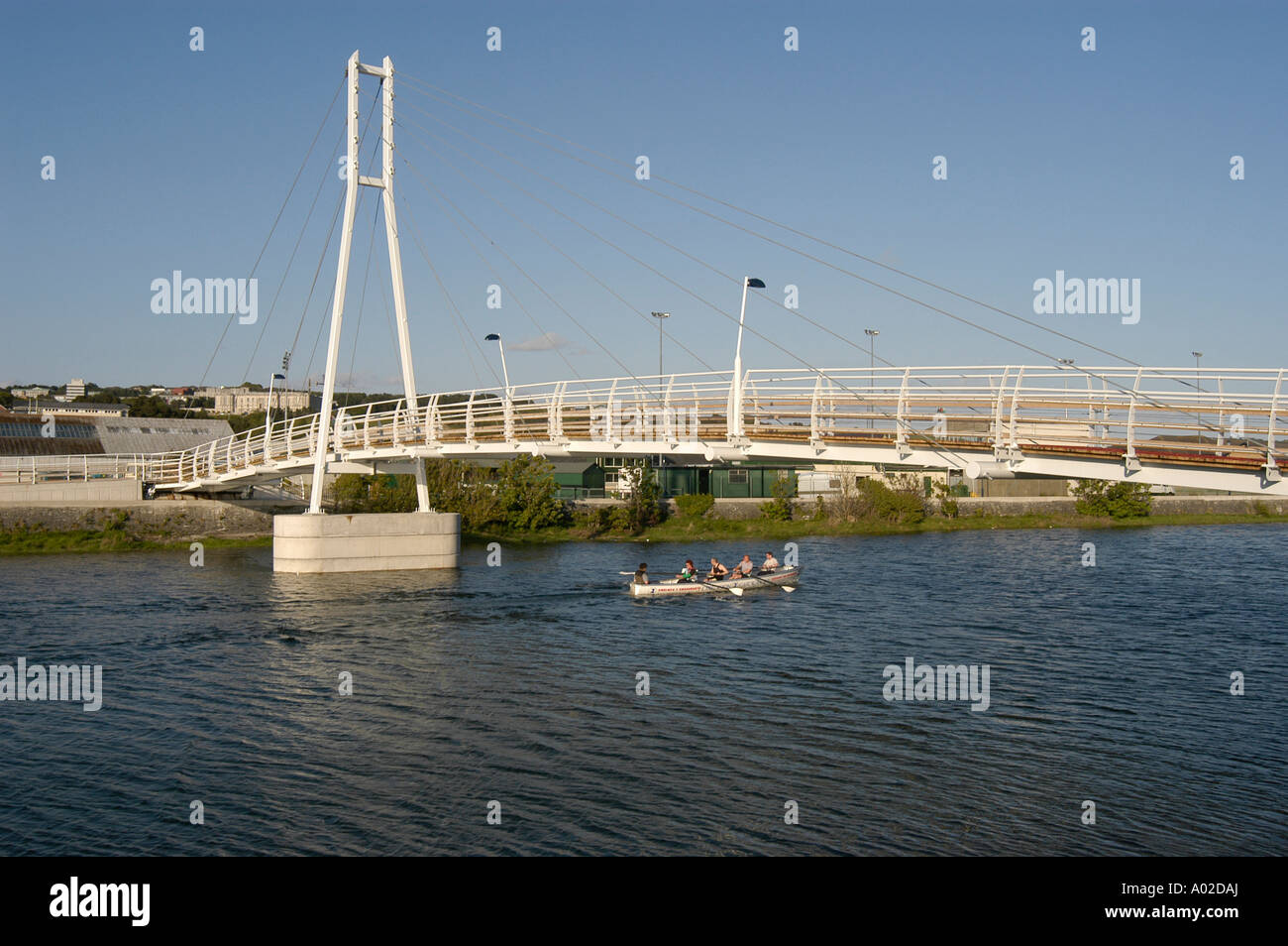 footbridge over the Rheidol River Aberystwyth with rowing boat passing ...