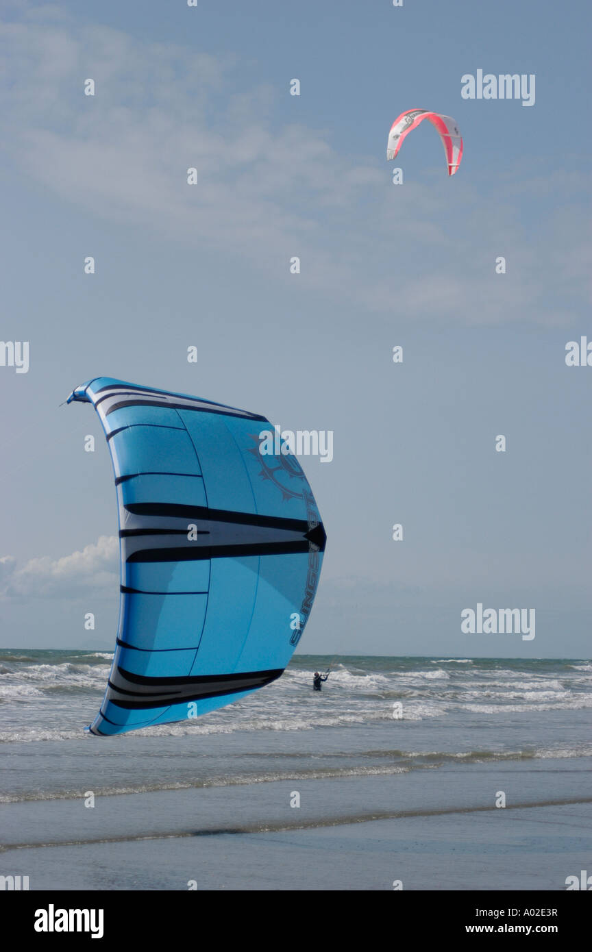 Flying large colourful stunt power kites on the beach at Ynyslas nature ...