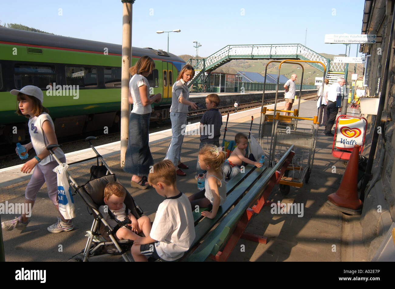 family with young children waiting at machynlleth railway station on ...
